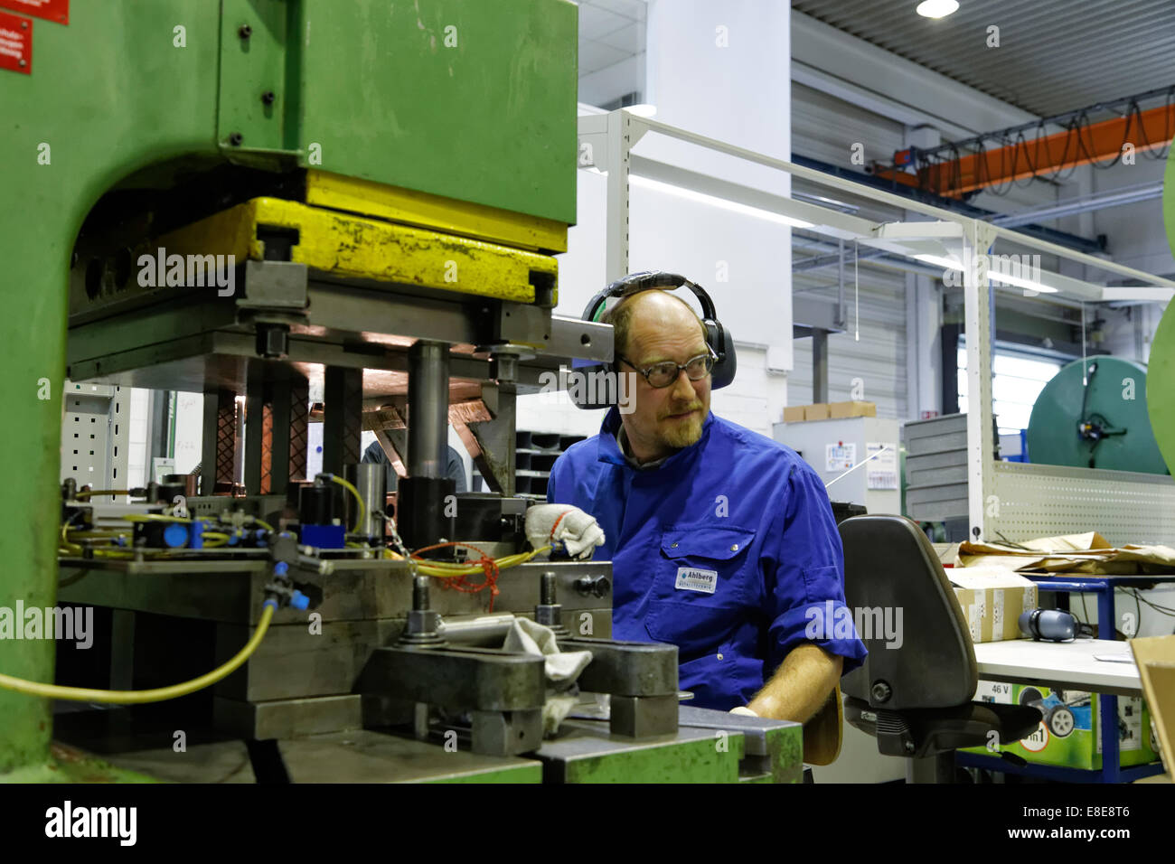 Berlin, Germany, skilled metal worker at a punching machine in the ...
