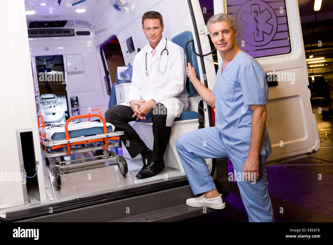 Doctors with an ambulance Stock Photo - Alamy
