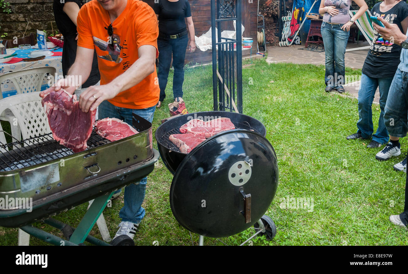 Very big steak during barbecue Stock Photo - Alamy