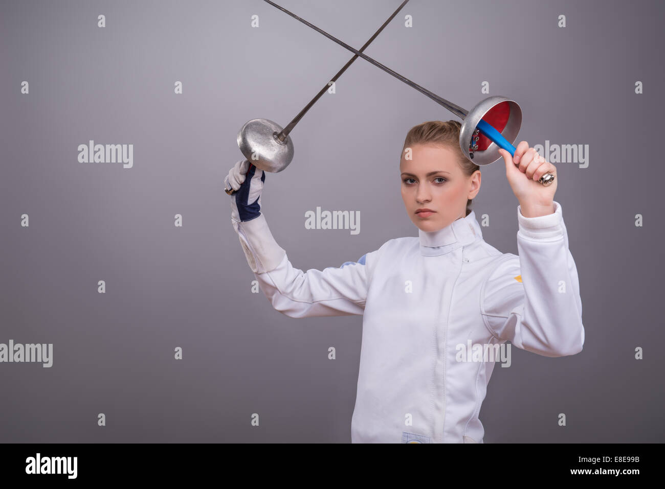 Serious blond young woman fence hi-res stock photography and images - Alamy