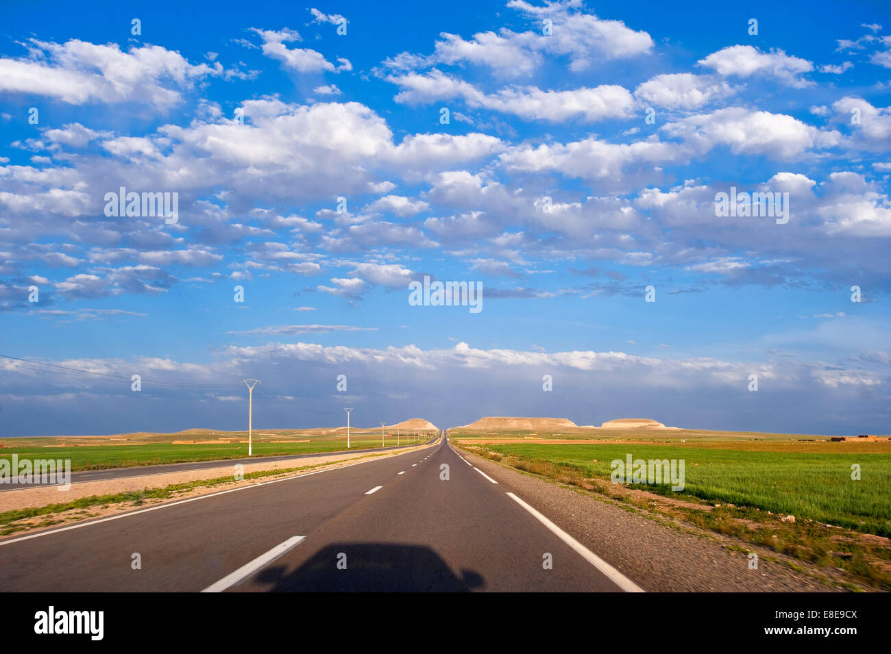 Horizontal perspective view of a long open road in Morocco Stock Photo ...