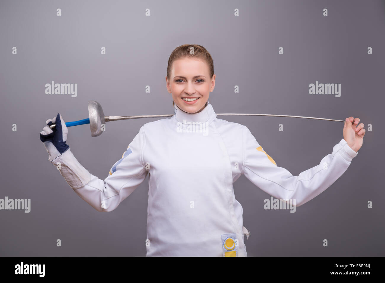 Young woman engaging in fencing Stock Photo - Alamy