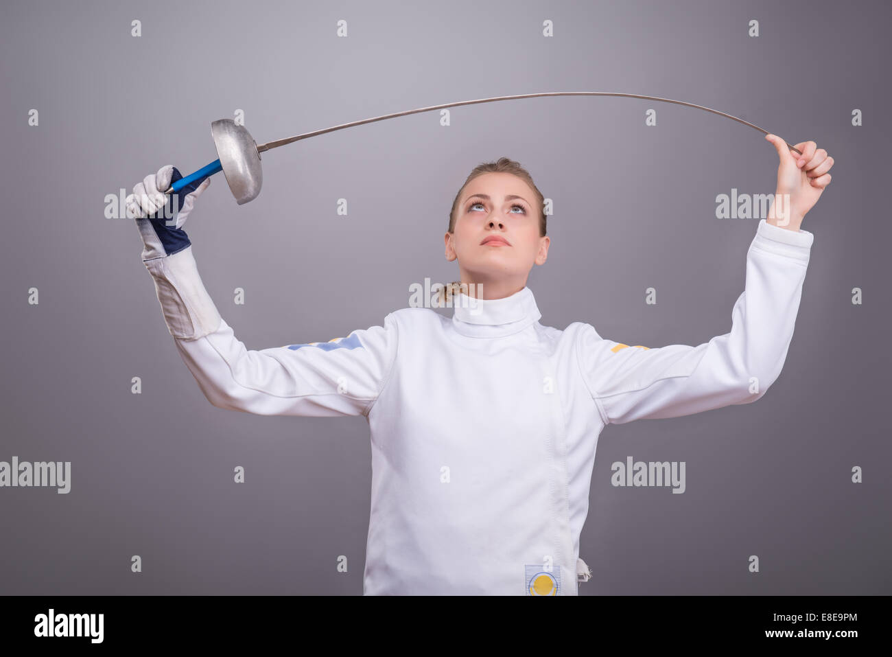 Young woman engaging in fencing Stock Photo - Alamy