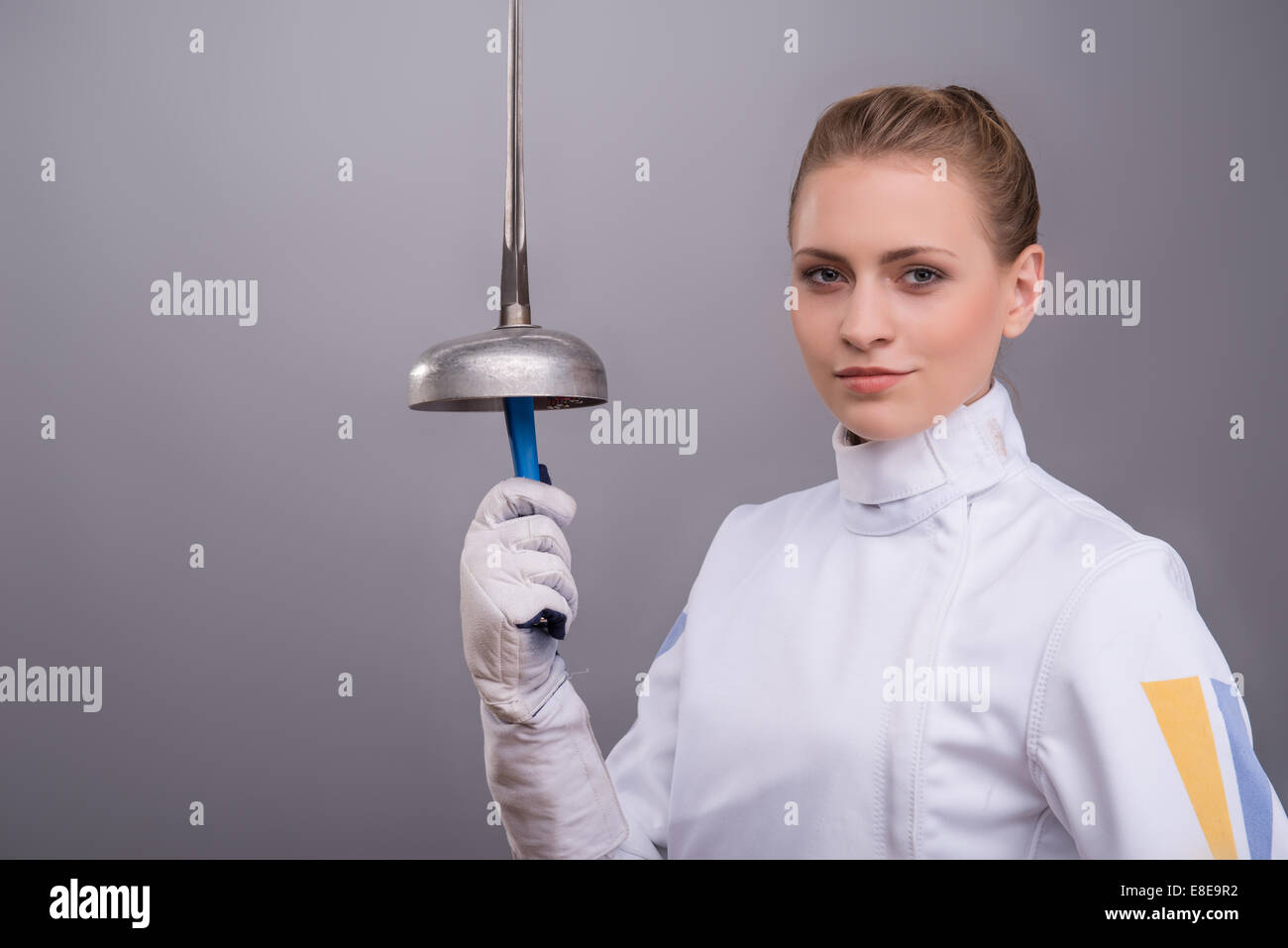 Young woman engaging in fencing Stock Photo - Alamy