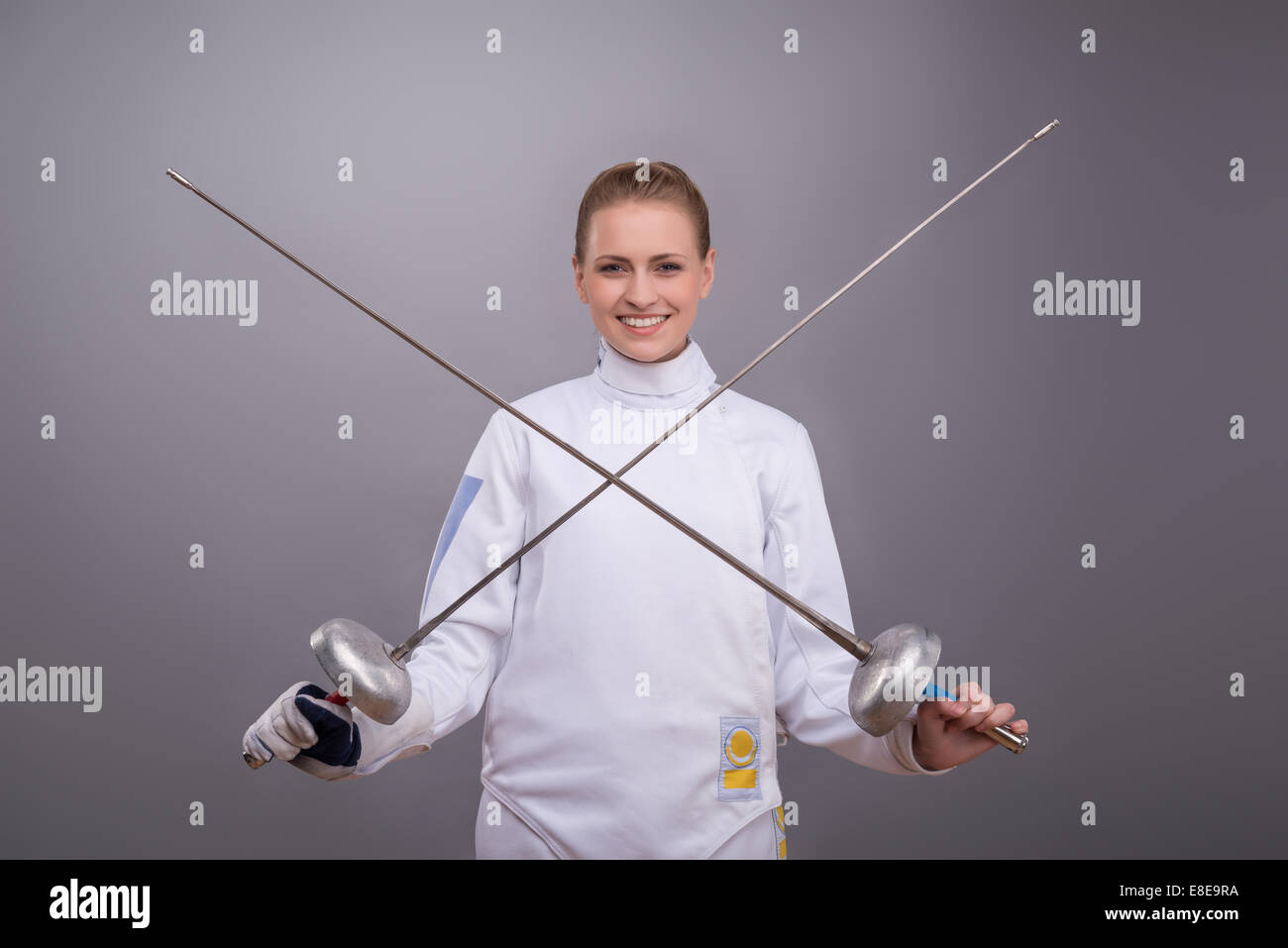 Young woman engaging in fencing Stock Photo - Alamy