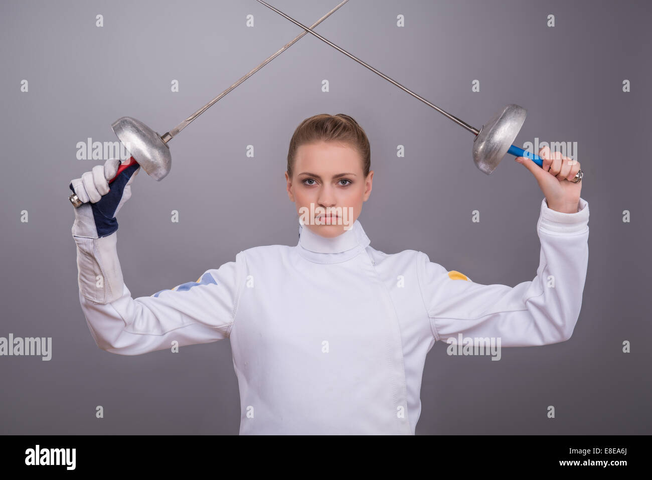 Young woman engaging in fencing Stock Photo - Alamy