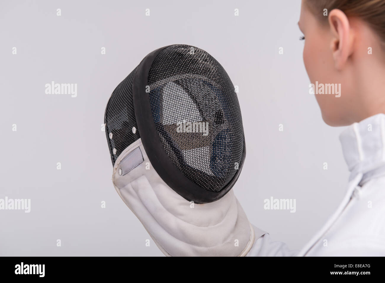 Young woman engaging in fencing Stock Photo - Alamy