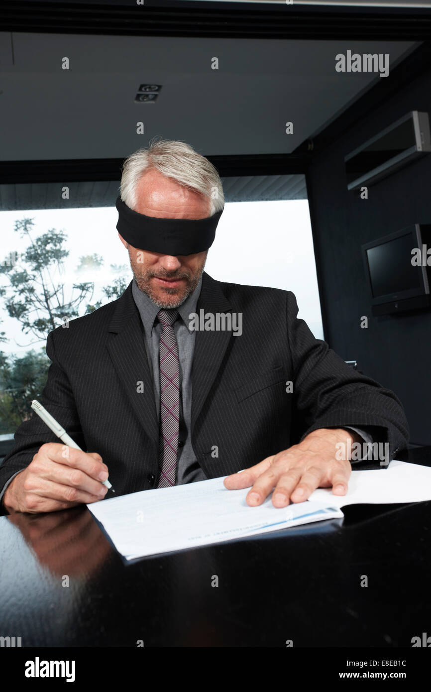 Blind man signing contract hi-res stock photography and images - Alamy