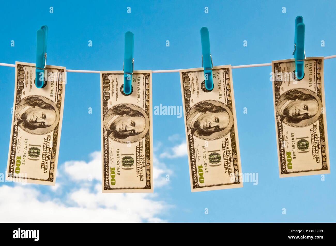American dollars hanging on a rope to dry - money laundering concept ...