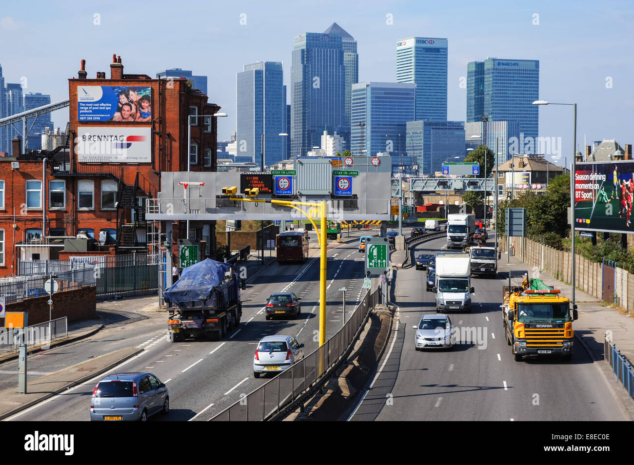 Traffic on A102 Blackwall Tunnel Approach with Canary Wharf skyscrapers ...