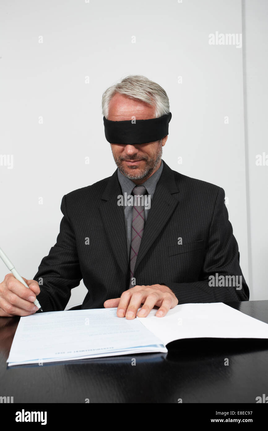 Blind man signing contract hi-res stock photography and images - Alamy