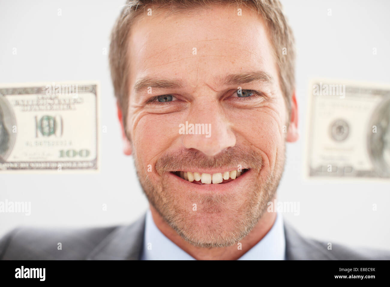 Happy man with dollar notes Stock Photo - Alamy