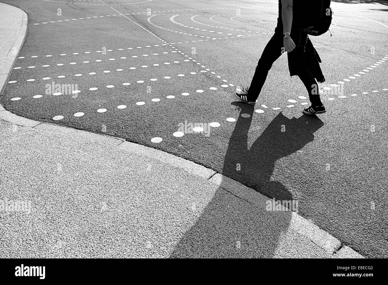 black and white photo of man walking on a sports pitch Stock Photo - Alamy