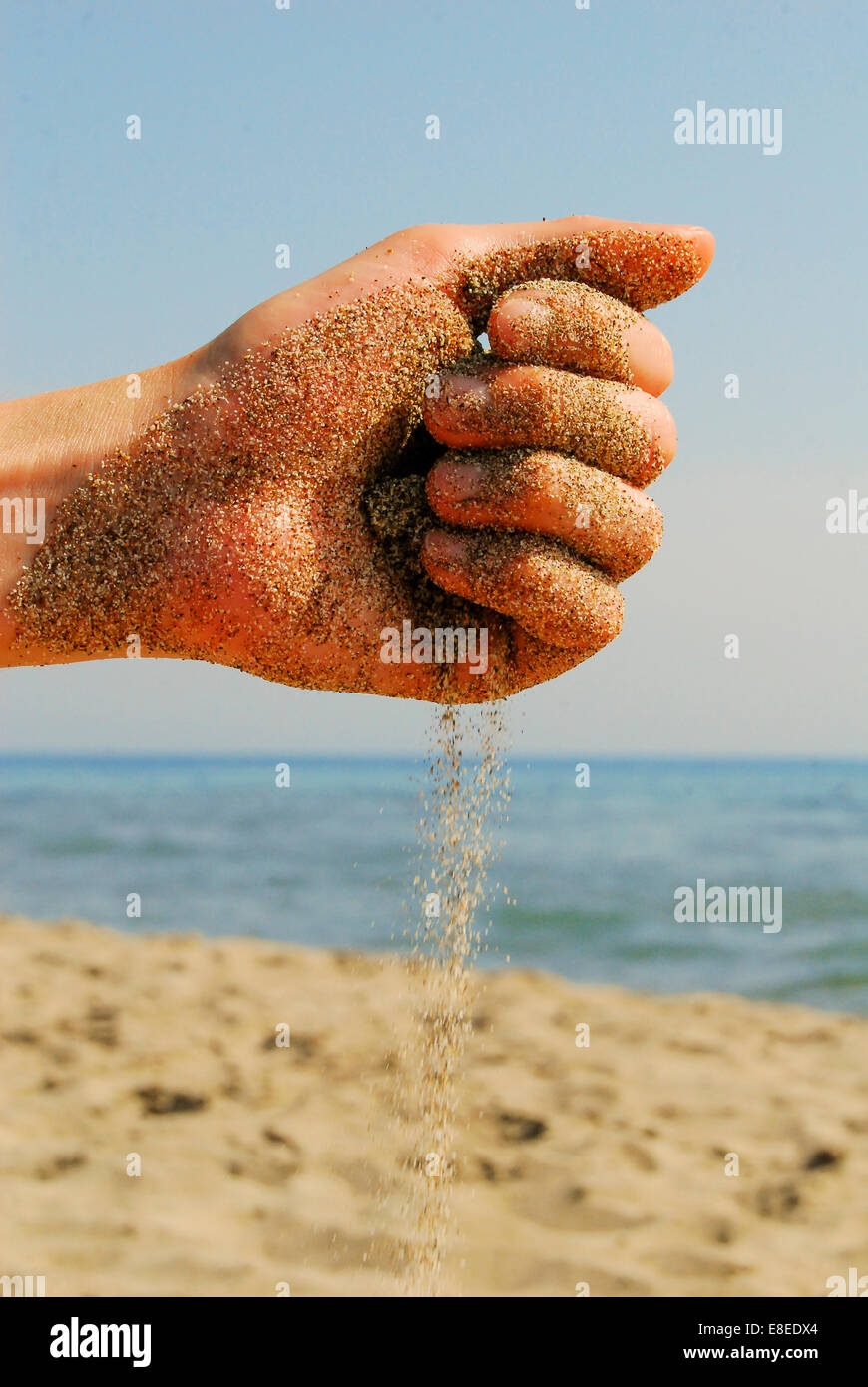 Sand grains falling Stock Photo - Alamy