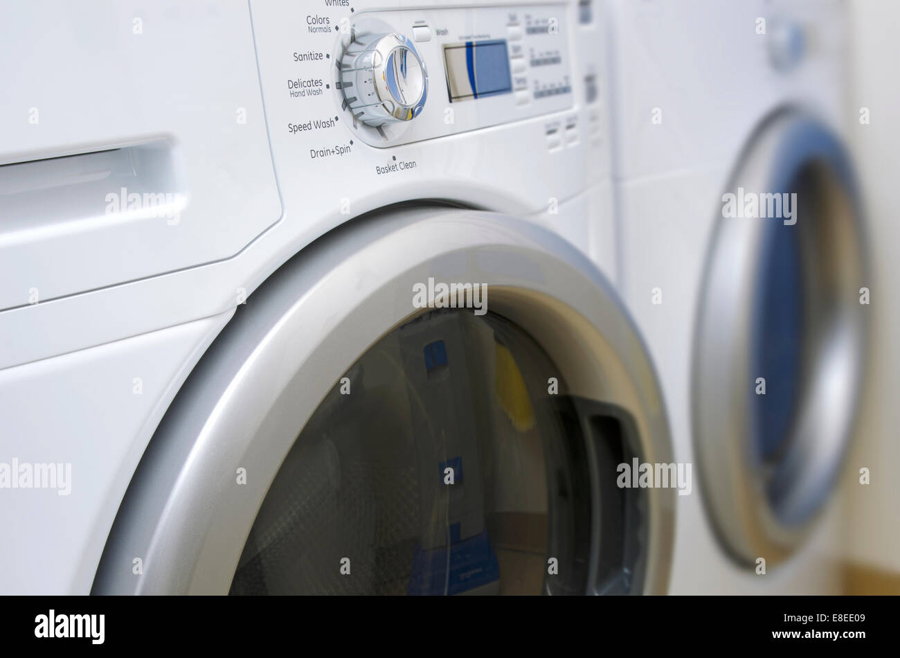Close up view of a modern, front loading, clothes washer and dryer ...