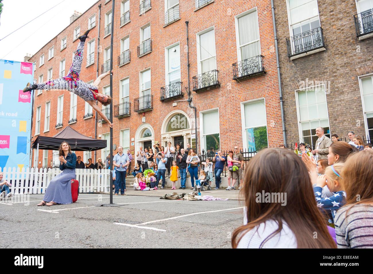 Dublin, Ireland - July 13: Acrobat on the pole in the Layal Healthcate ...