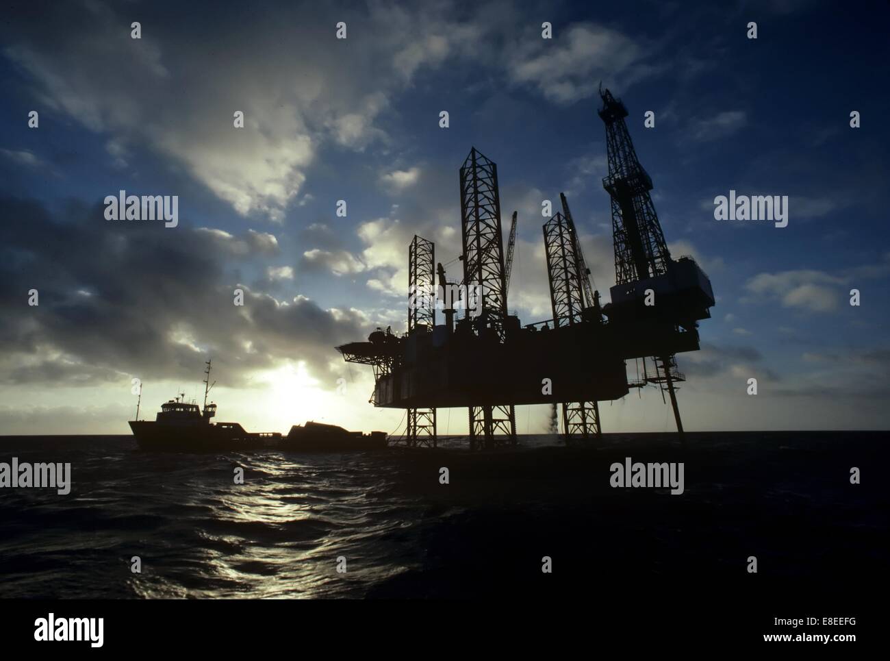 Offshore Oil Drilling Rig and Supply Boat Stock Photo - Alamy