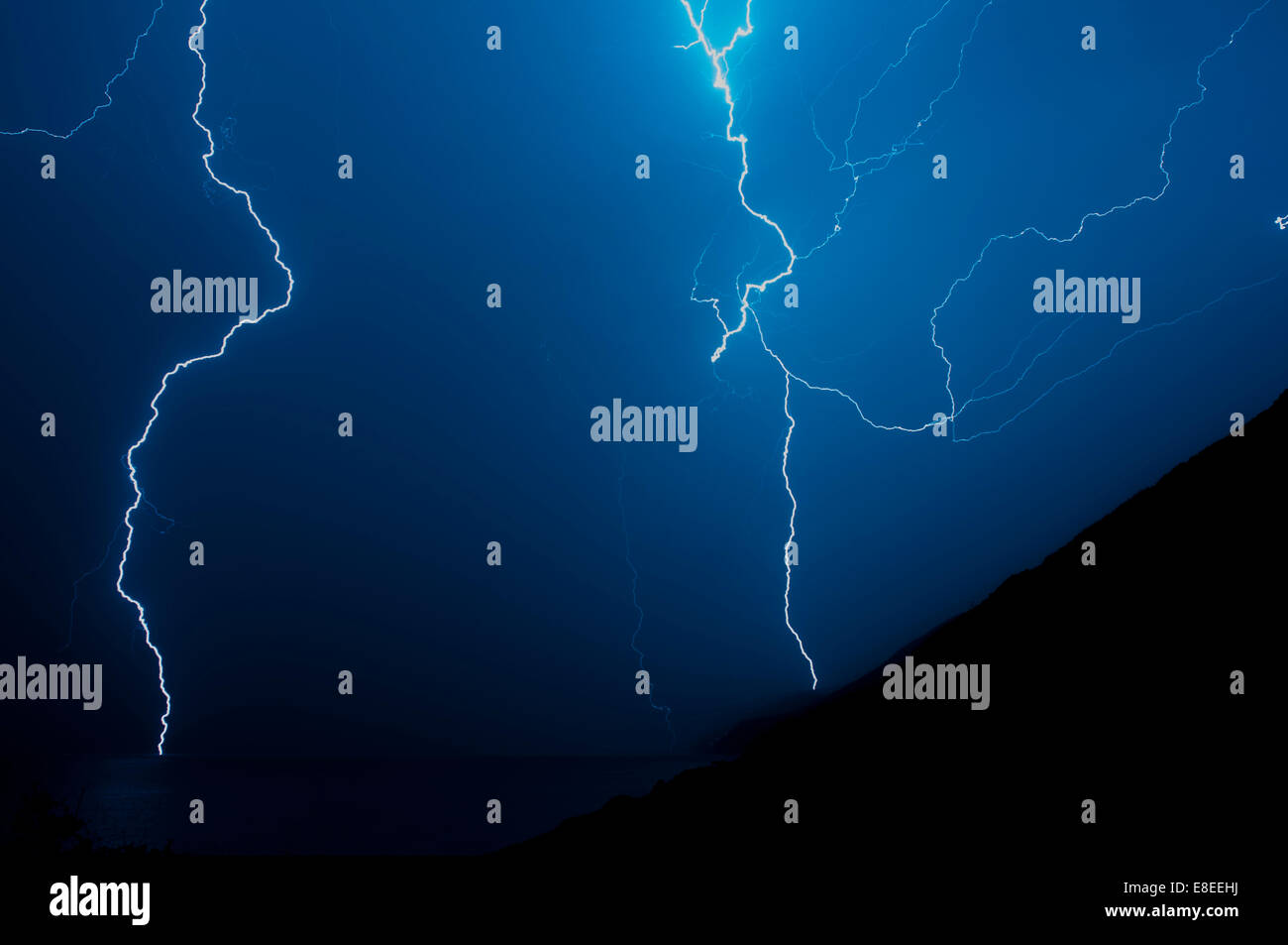 Lightning strike behind storm hi-res stock photography and images - Alamy