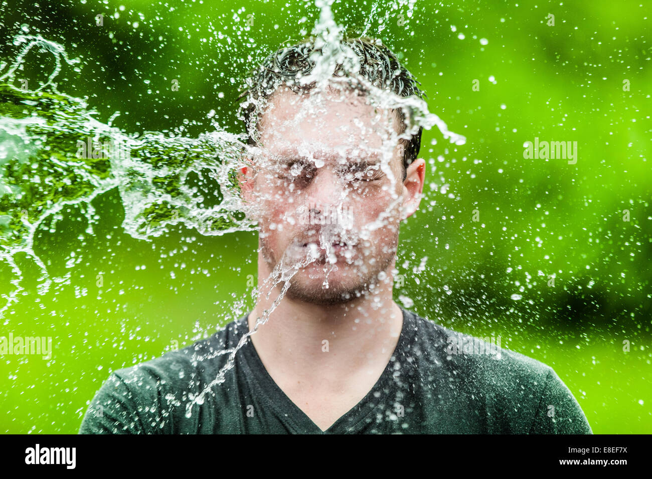 Young Adult That Got Completely Drenched with Green Background Stock ...
