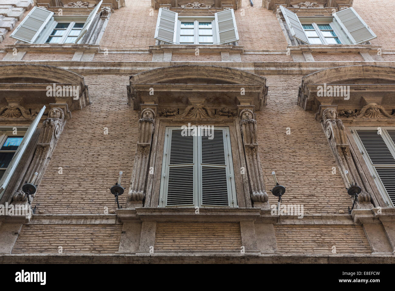 Ornate roman windows with shutters, Rome, Italy Stock Photo - Alamy