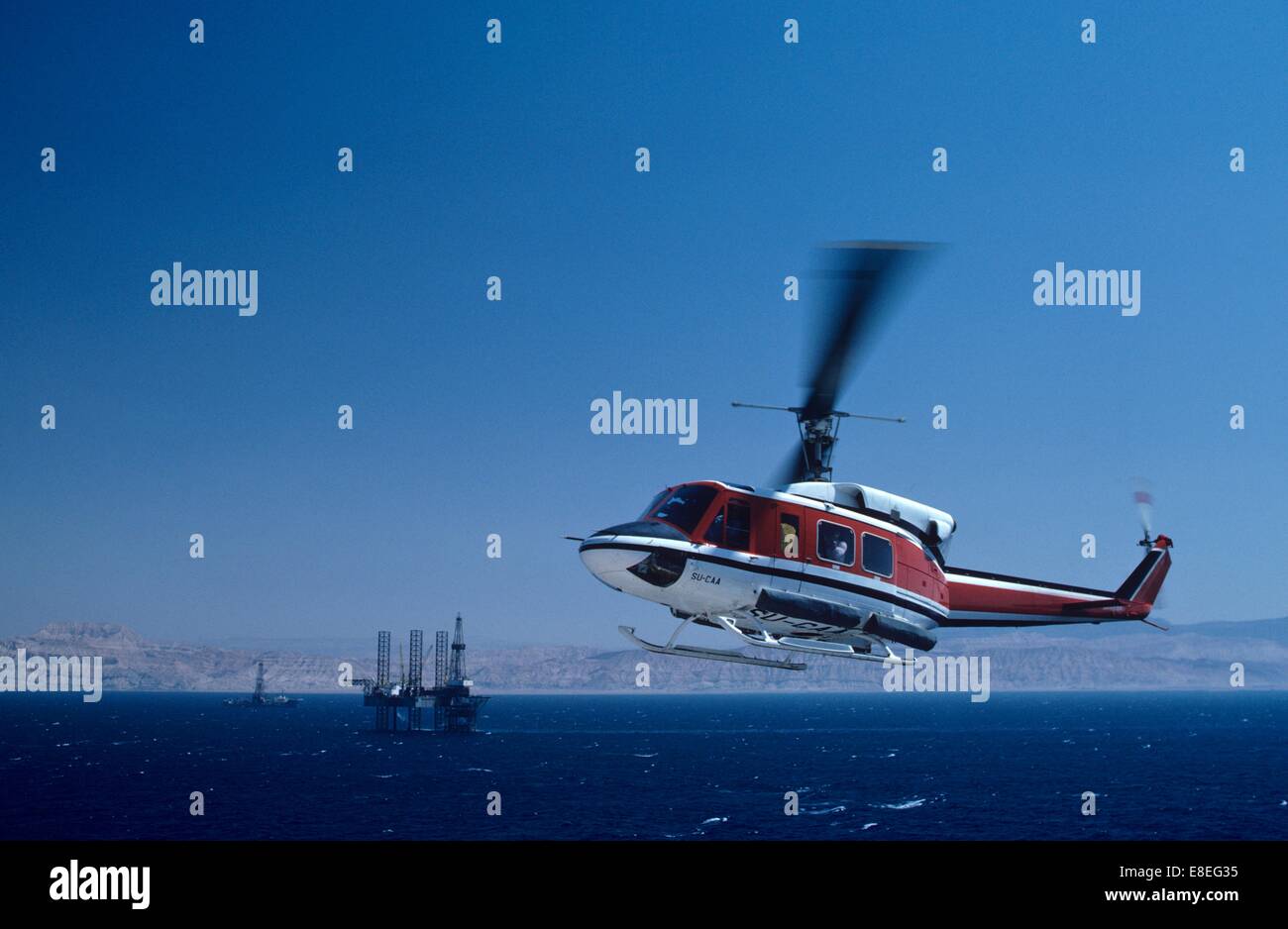 Helicopter Preparing for Landing on Offshore Oil Drilling Rig Stock ...