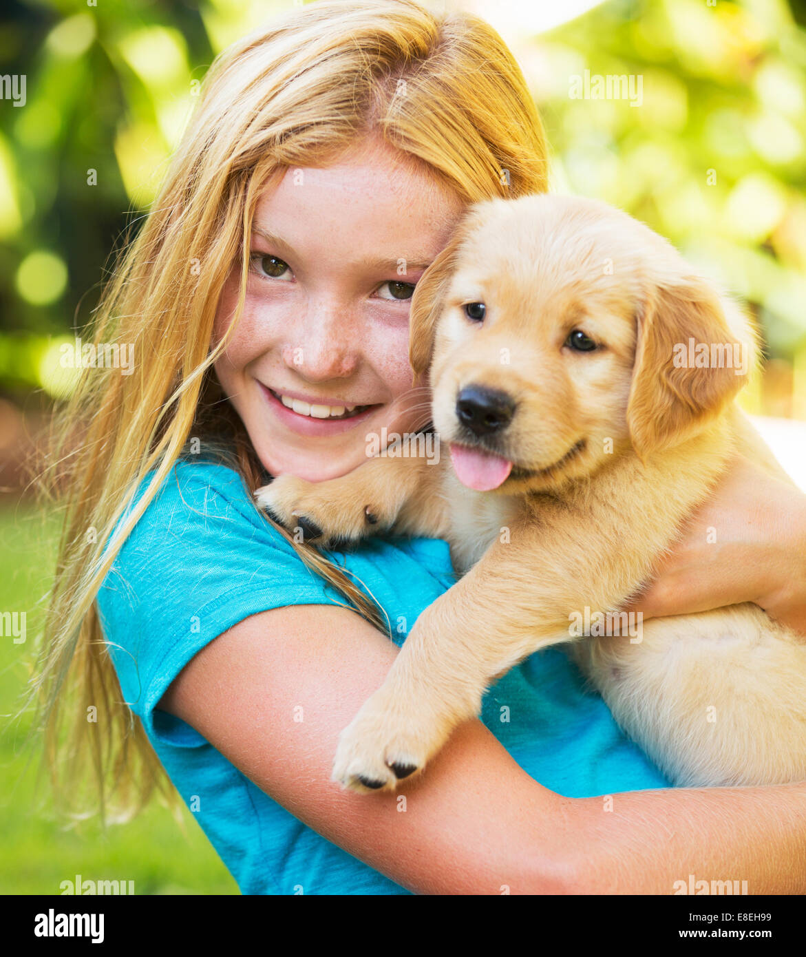 Adorable Cute Young Girl Playing and Hugging Puppies Stock Photo - Alamy