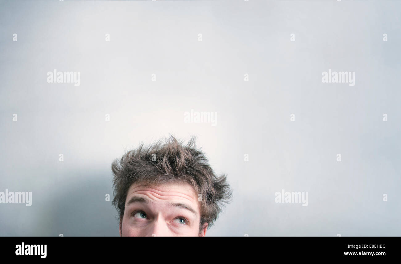 Funny morning look of a young adult men with on a white (greenish ...