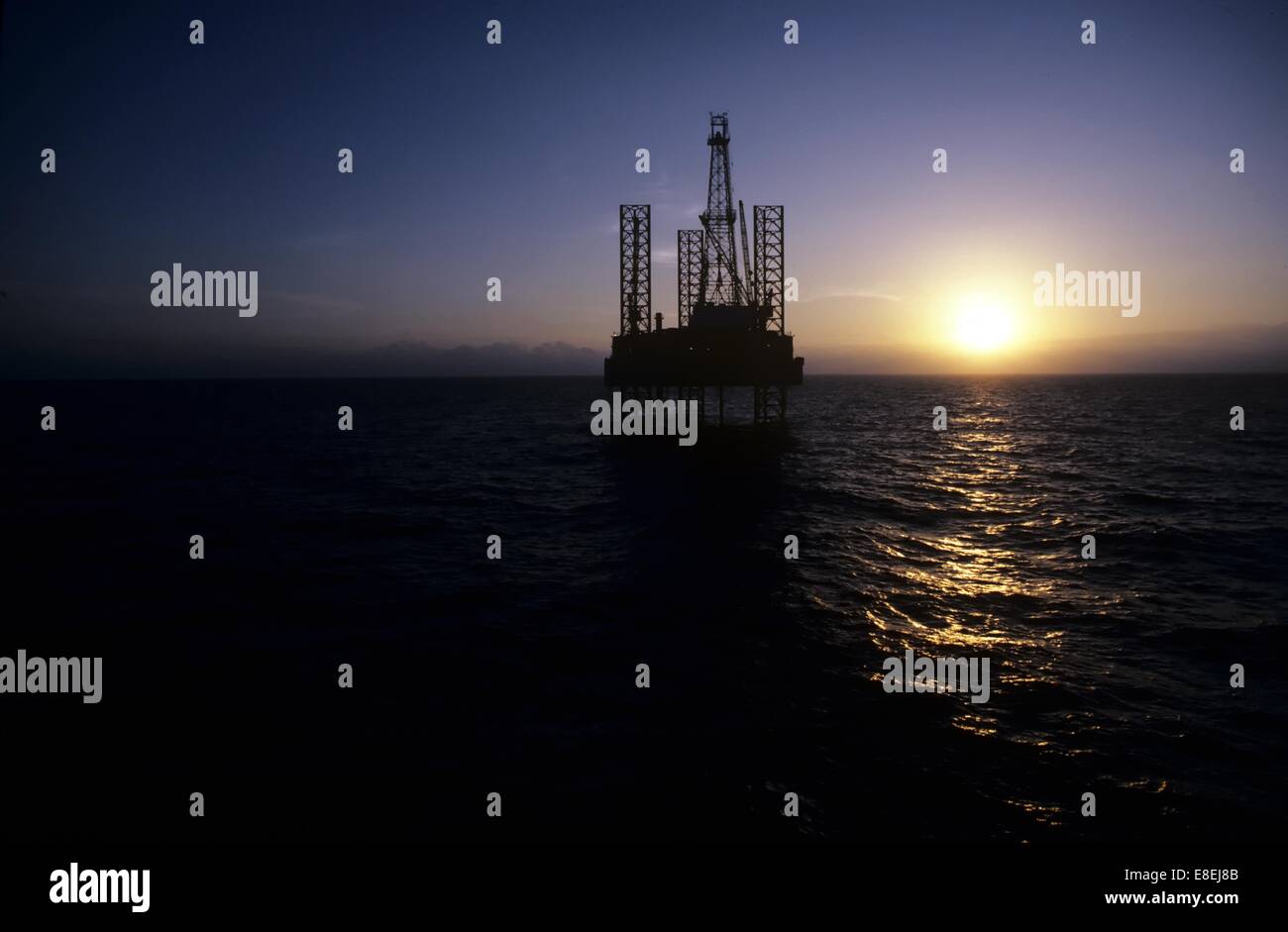Offshore Oil Drilling Rig at Sunset Stock Photo - Alamy