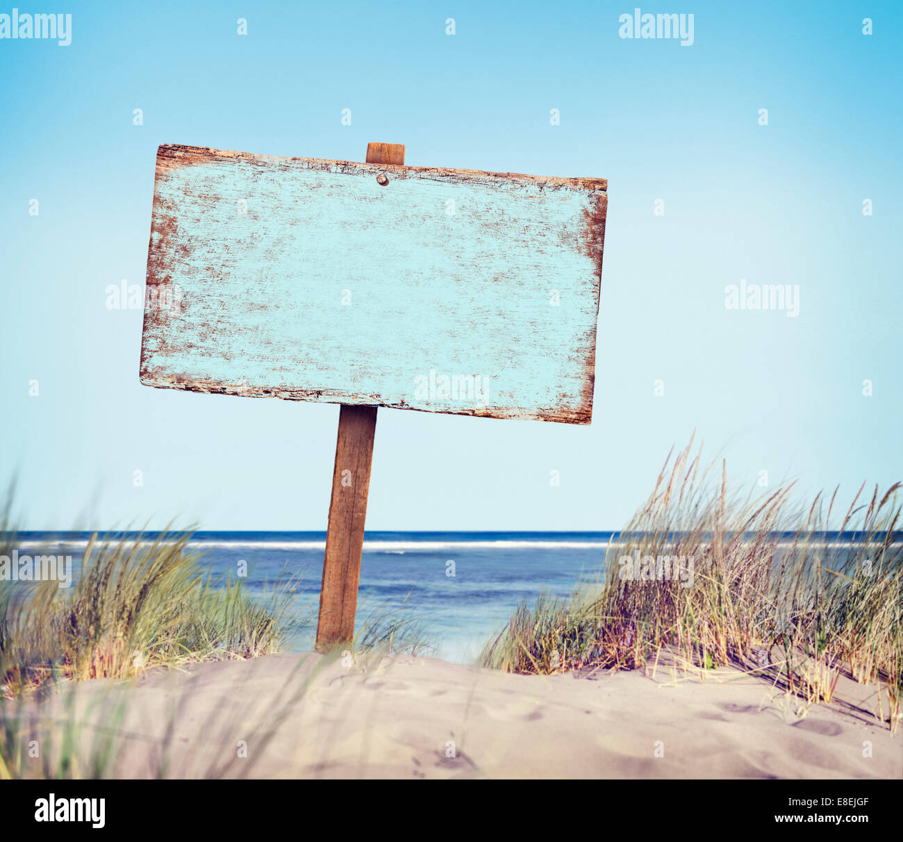 Beach with Empty Plank Sign Stock Photo - Alamy