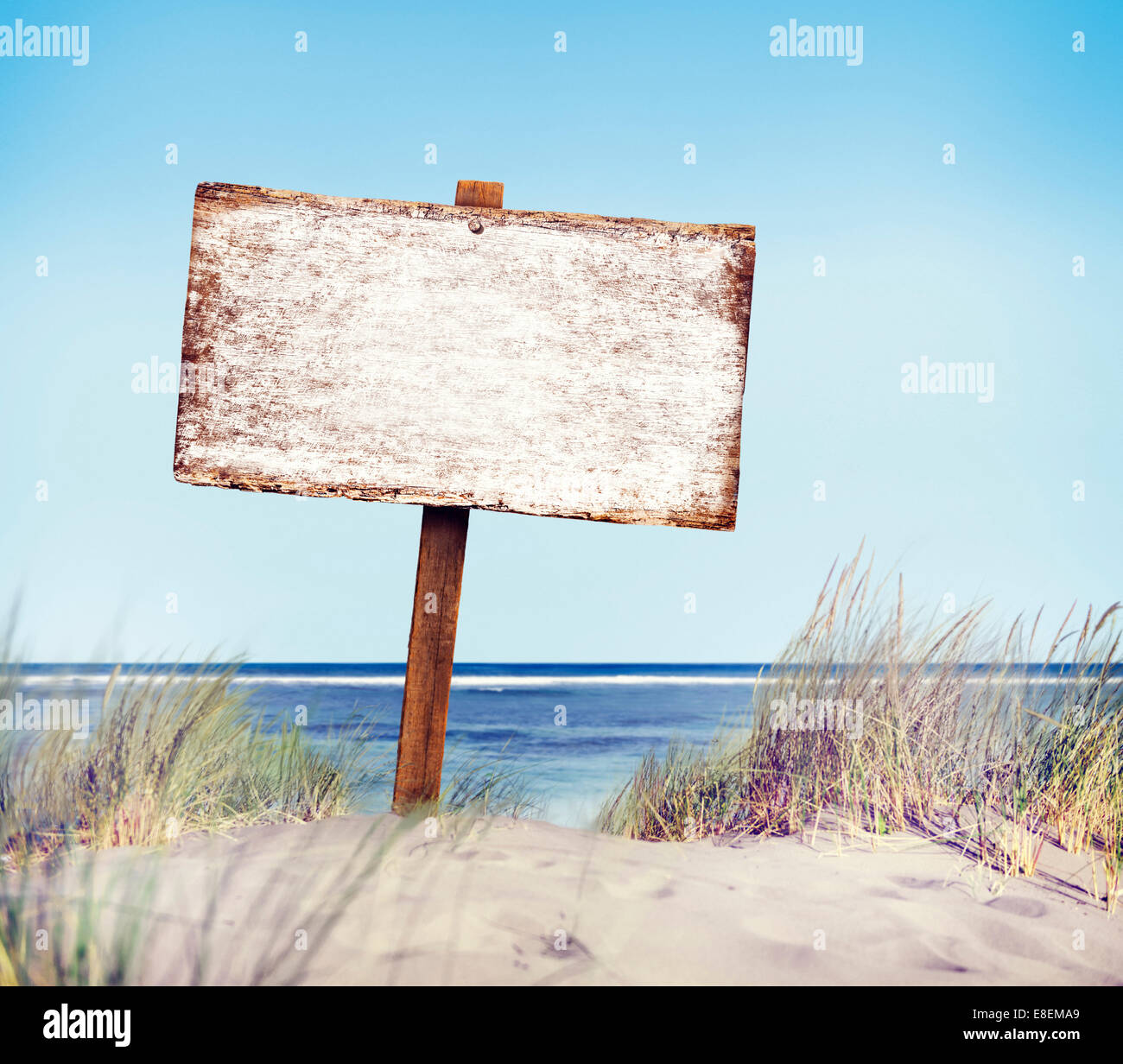 Beach with Empty Plank Sign Stock Photo - Alamy