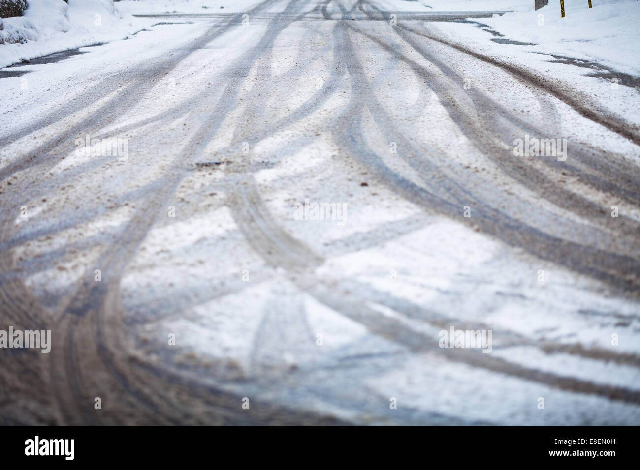 Snow-covered road, the marks of wheels Stock Photo - Alamy