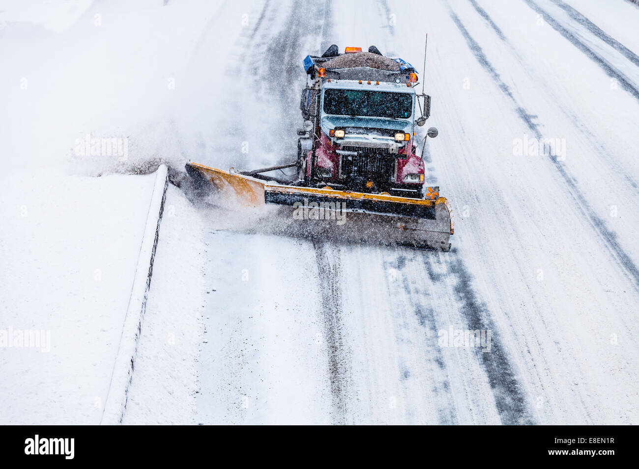 Snowplow Truck Removing the Snow from the Highway during a Cold ...