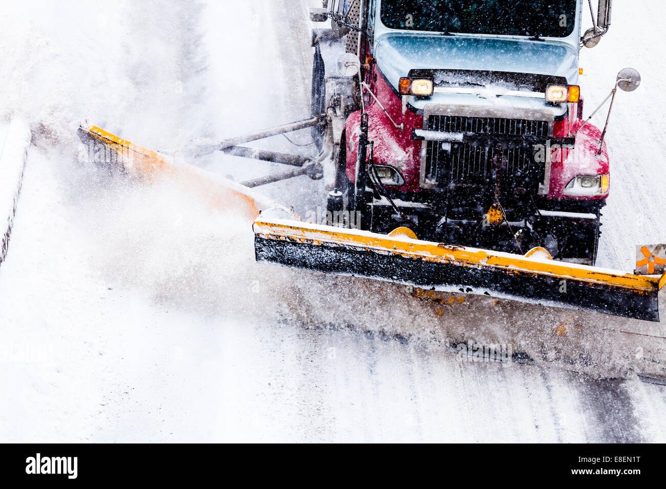Snowplow Truck Removing the Snow from the Highway during a Cold ...