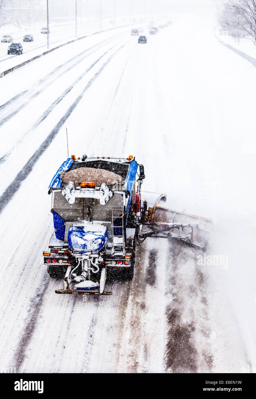 Snowplow Truck Removing the Snow from the Highway during a Cold ...