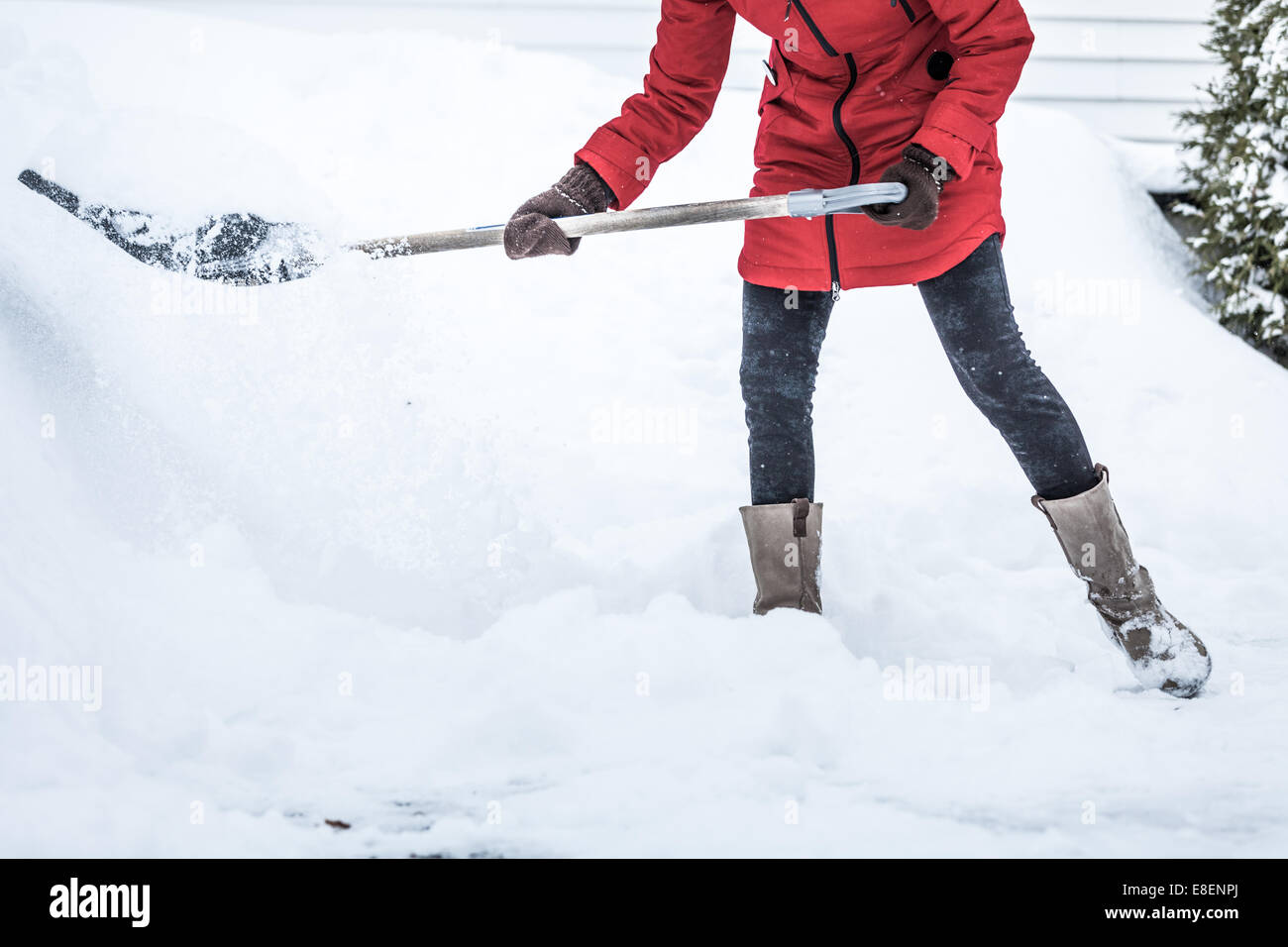 Woman shoveling snow hi-res stock photography and images - Alamy