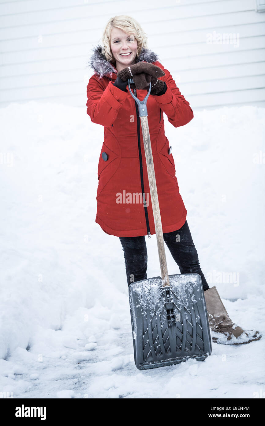 Woman shoveling snow shovel hi-res stock photography and images - Alamy
