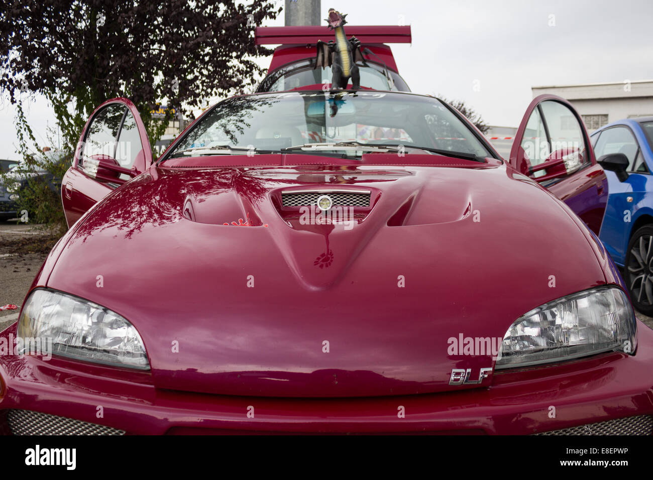 The display of cars with flashy body works and interiors excellently ...