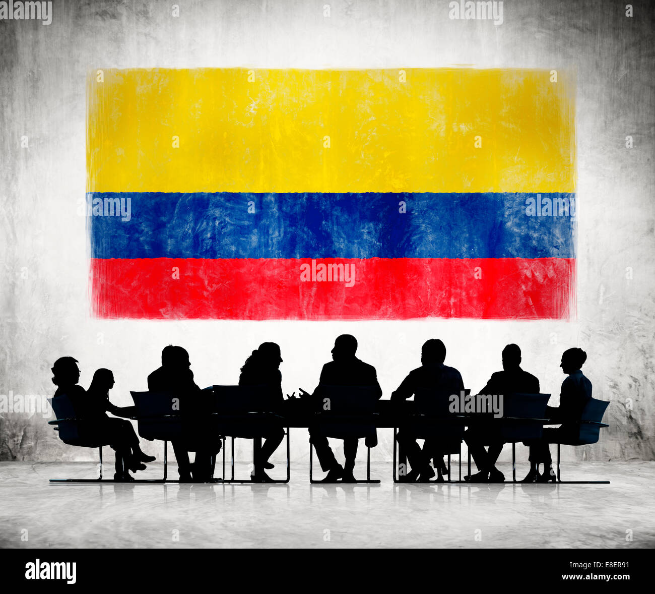 Business People in a Meeting with Colombian Flag Stock Photo - Alamy