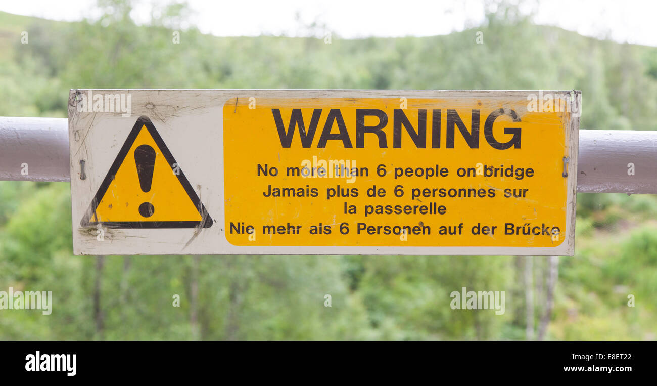 Warning sign at a bridge, no more than 6 people on bridge Stock Photo ...