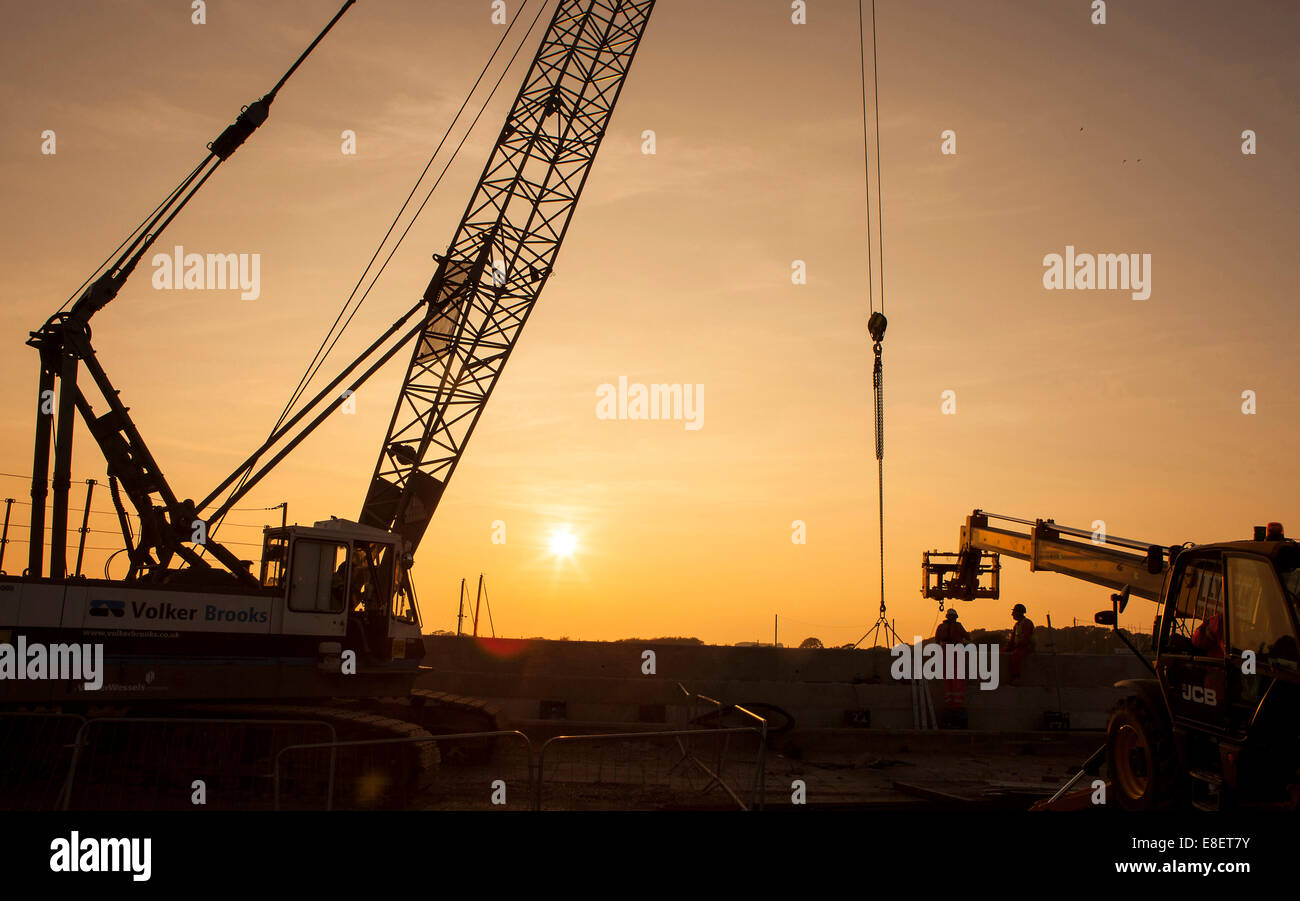 A construction site at sunset Stock Photo - Alamy