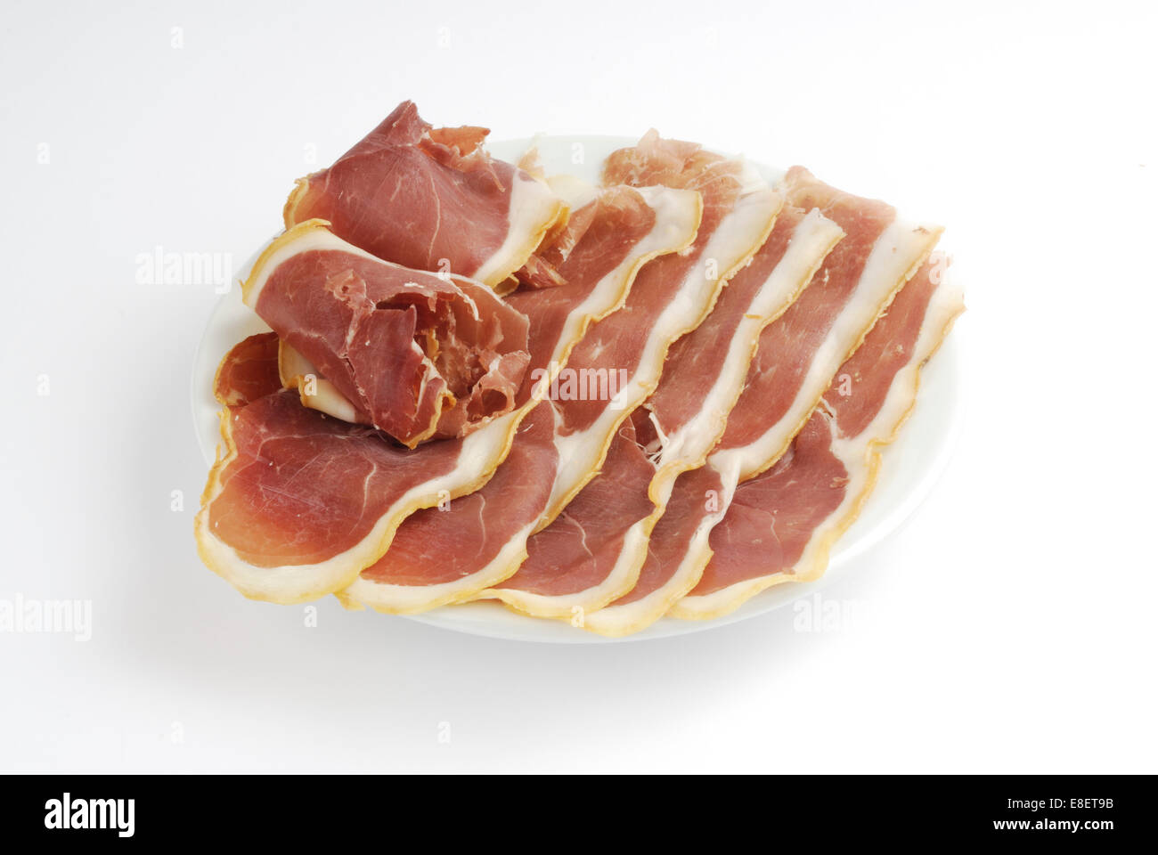 strips of ham on white background Stock Photo - Alamy
