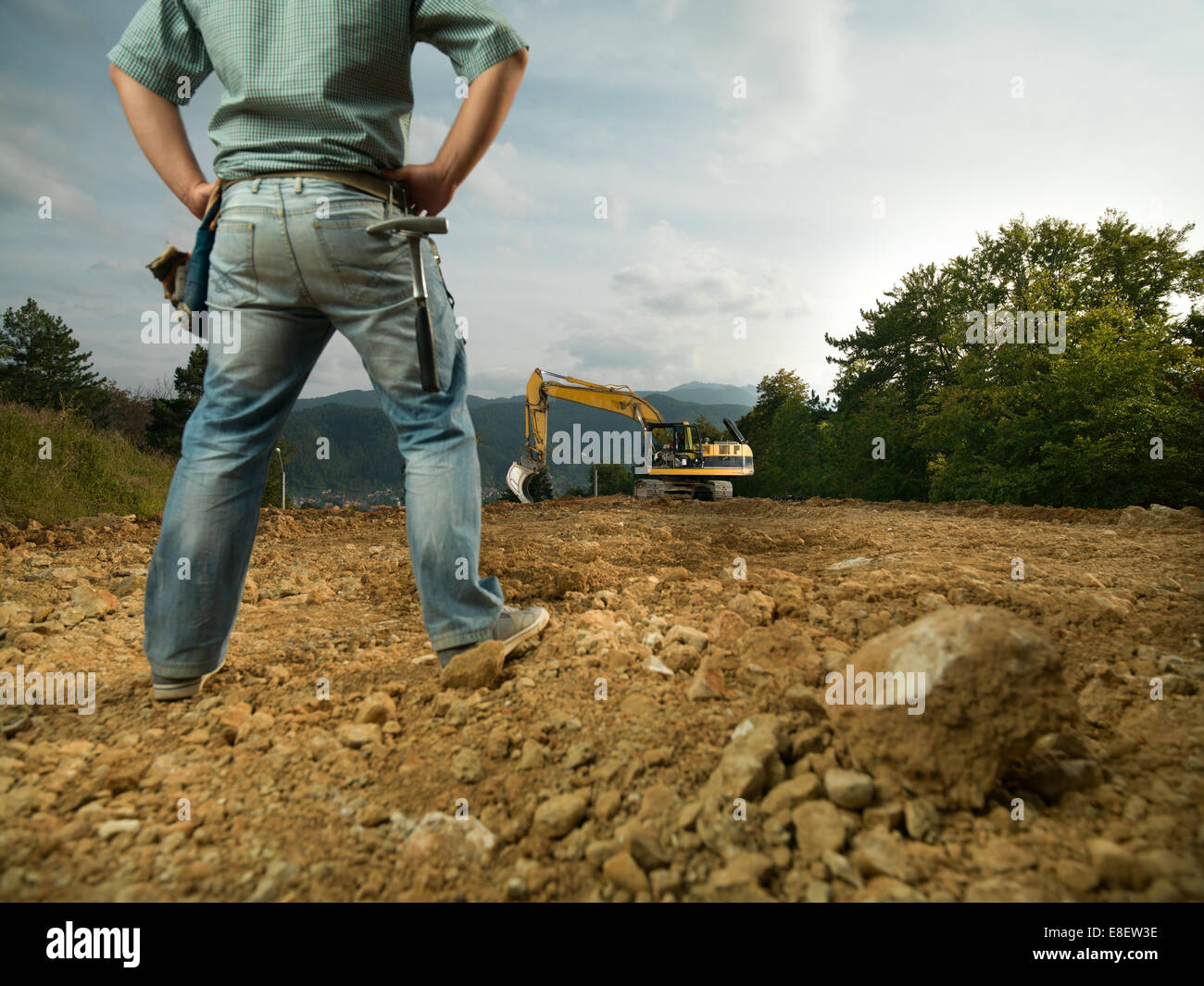 closeup, back view of male engineer standing on construction site Stock ...