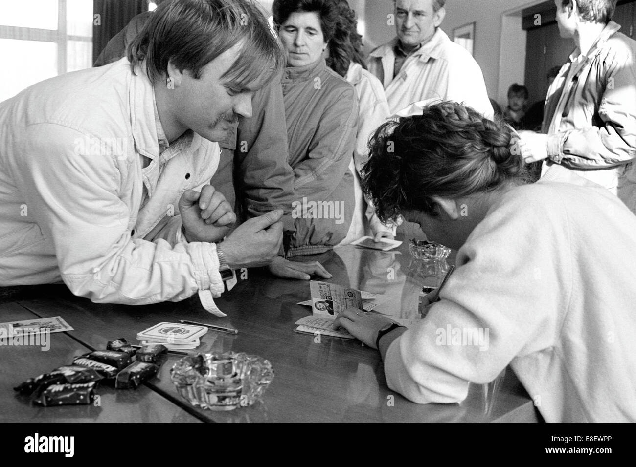 East German citizens travelling, cashing in their welcome money, day of ...