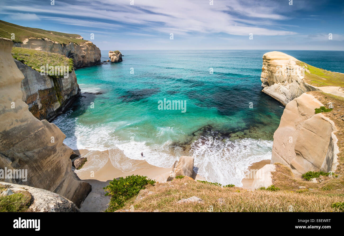 Solitary person on the rocky cliffs of the Pacific coast in the ...