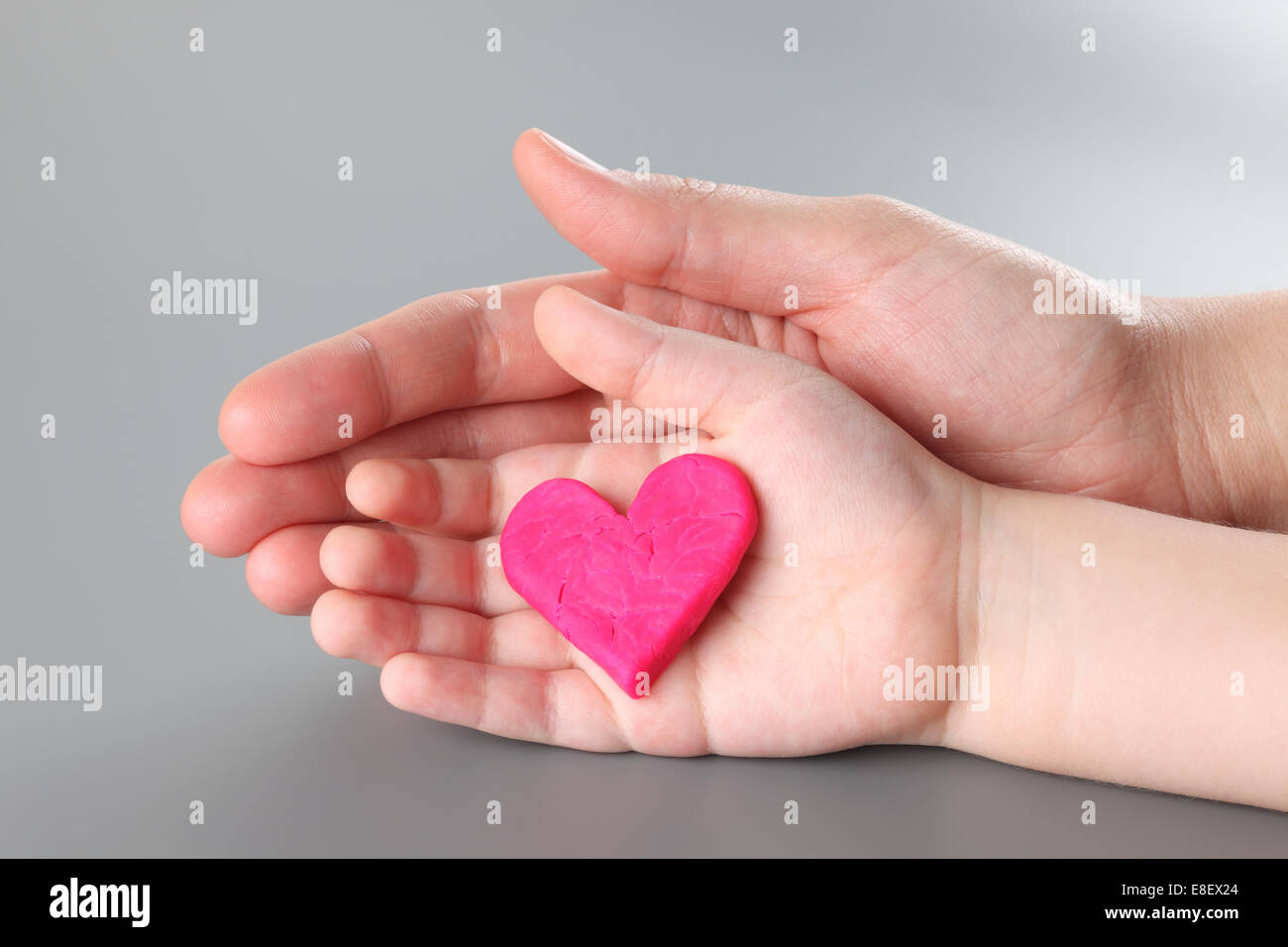 Child holding broken heart hi-res stock photography and images - Alamy