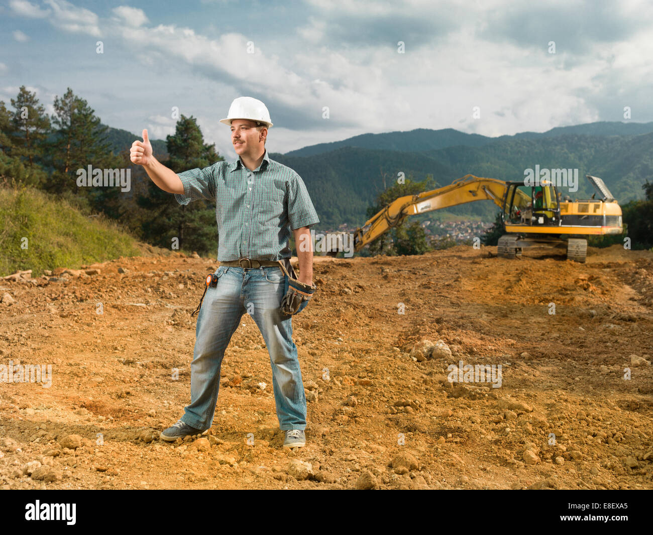 male engineer showing ok sign on construction site Stock Photo - Alamy