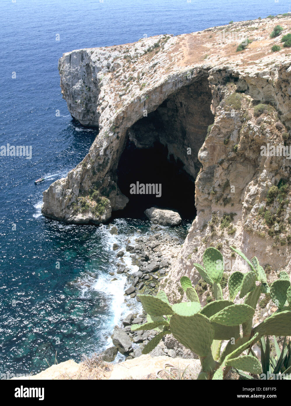 View of natural bridge and boat, Blue Grotto, Malta Stock Photo - Alamy