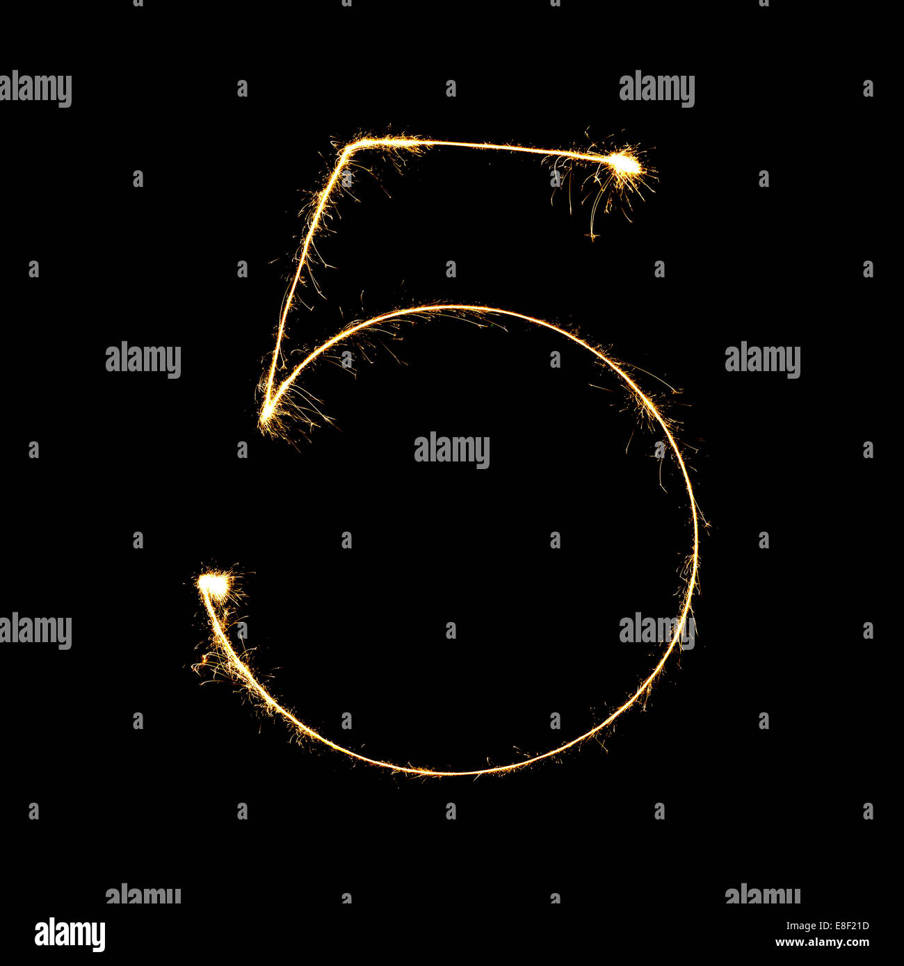 burning sparkler stick and writing sparkling text . number five ...