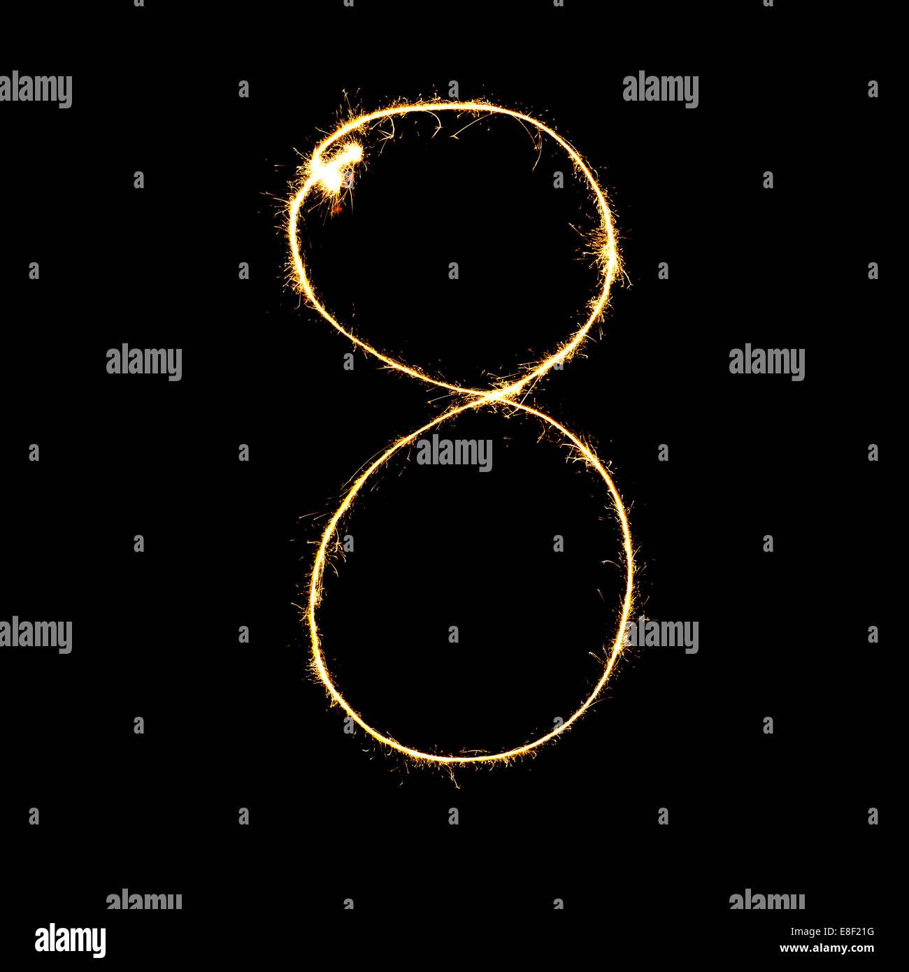 burning sparkler stick and writing sparkling text . number eight ...