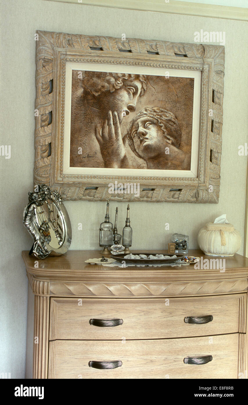 Lime washed frame on picture above lime washed chest-of-drawers Stock ...